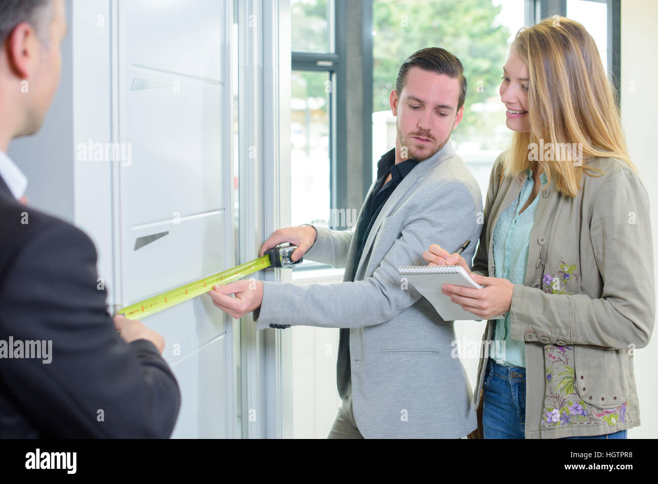 man measuring the wall Stock Photo - Alamy