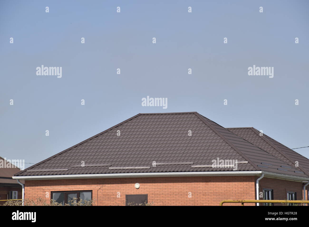 Detached house with a roof made of steel sheets. Roof metal sheets ...