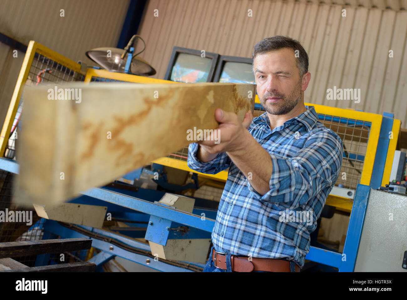 sawmill employee working with wood tools and machinery Stock Photo - Alamy