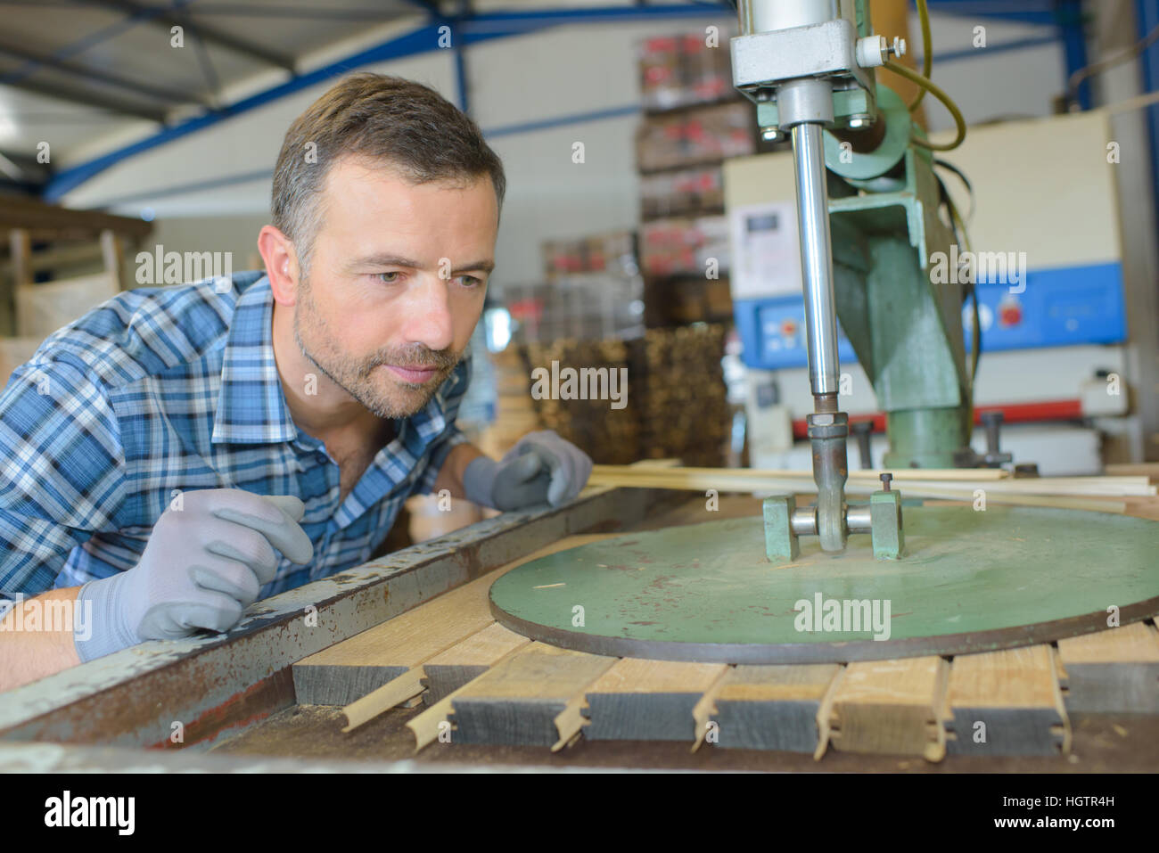 sawmill employee working with wood tools and machinery Stock Photo - Alamy