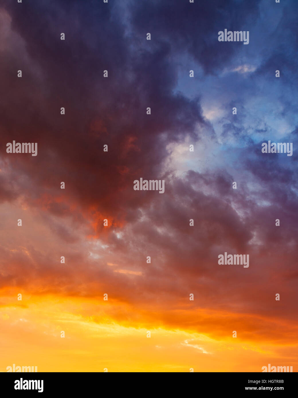Fiery vivid sunset sky clouds Stock Photo - Alamy