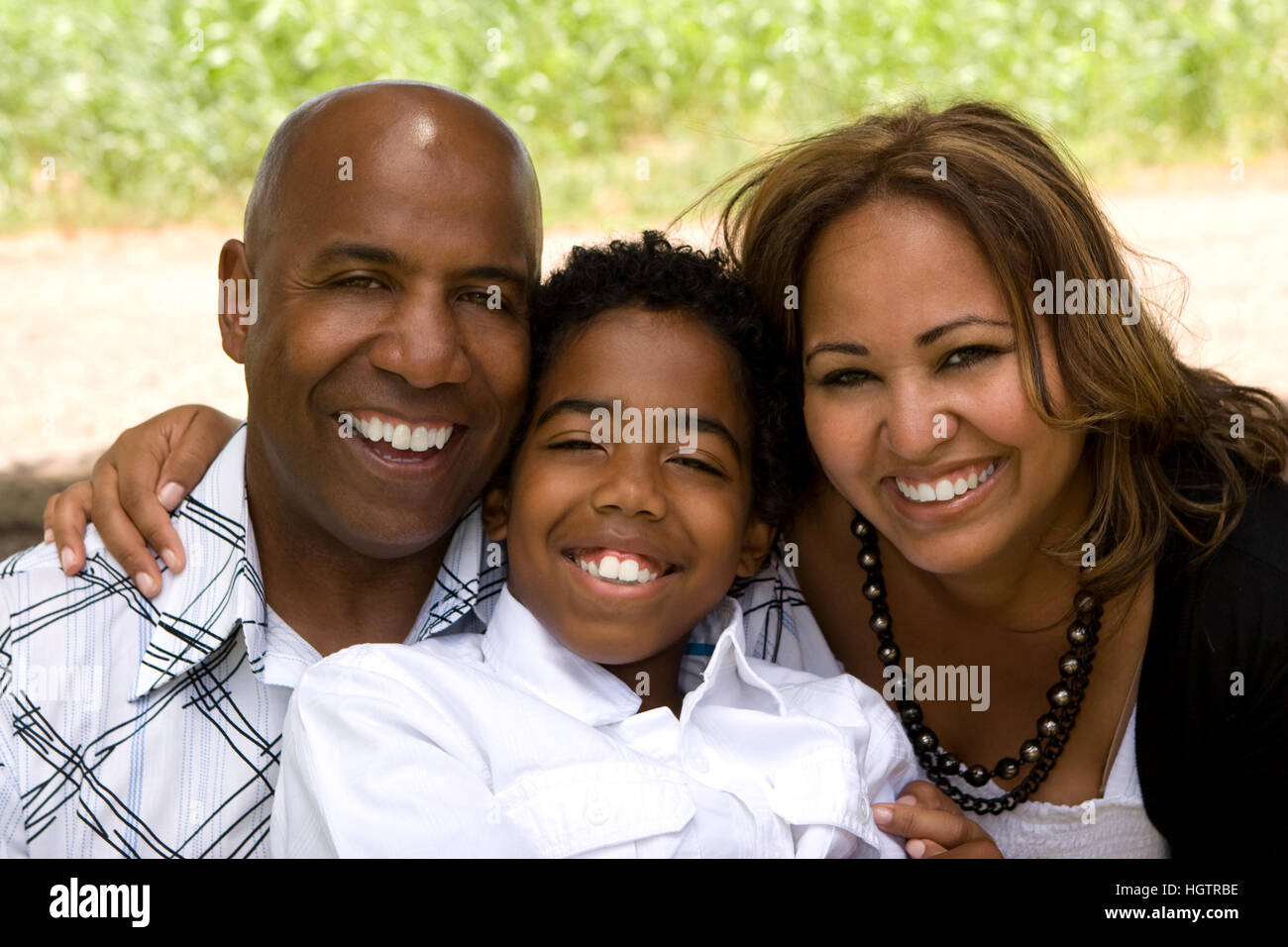 Portrait of happy multicultural family smiling Stock Photo - Alamy