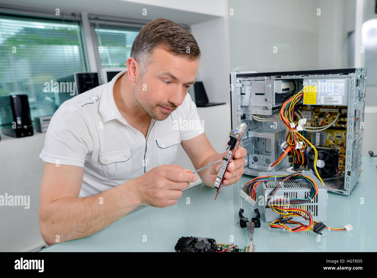 technician fixing computer part Stock Photo - Alamy