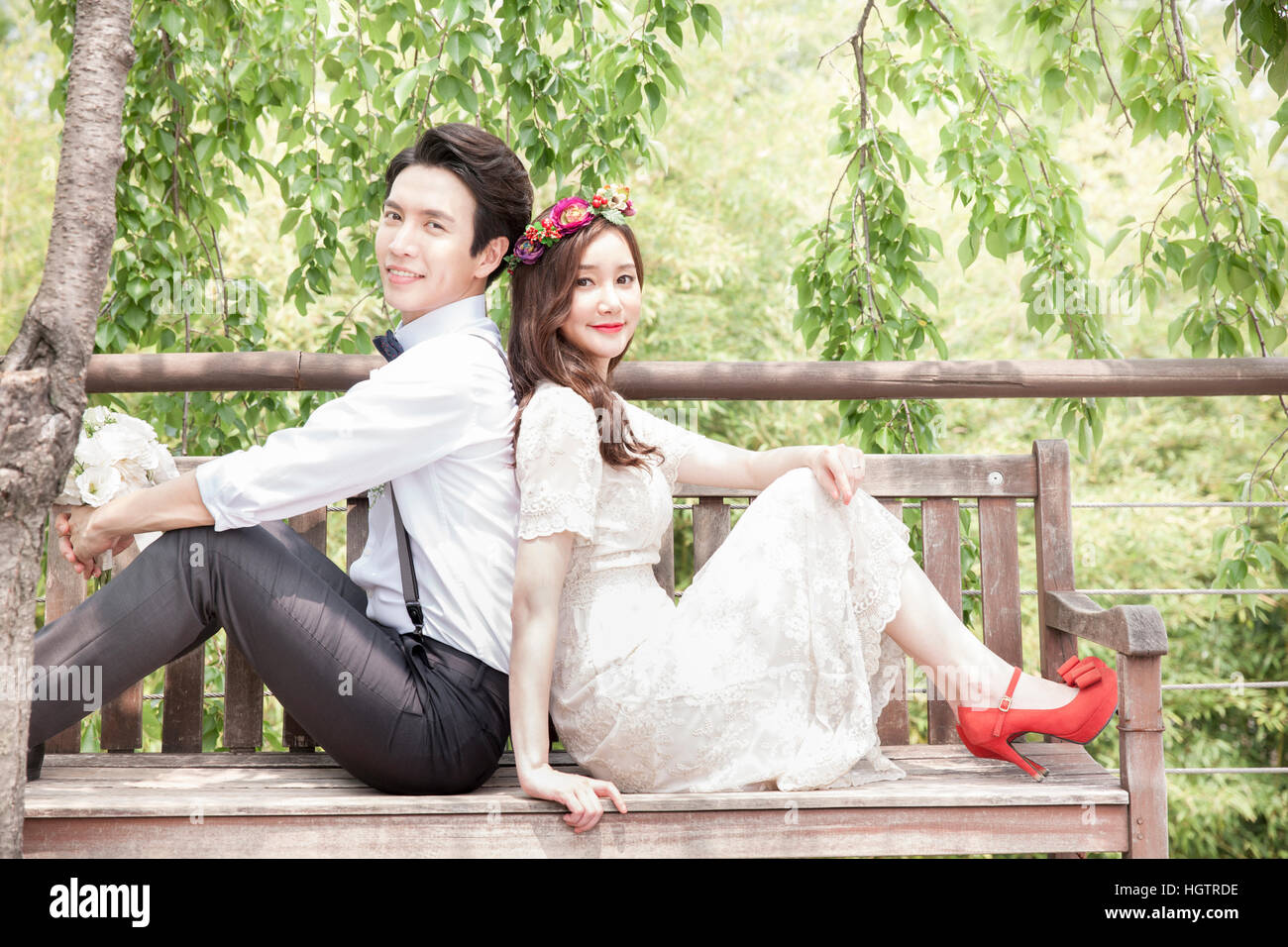 Back view of couple sitting hi-res stock photography and images - Alamy