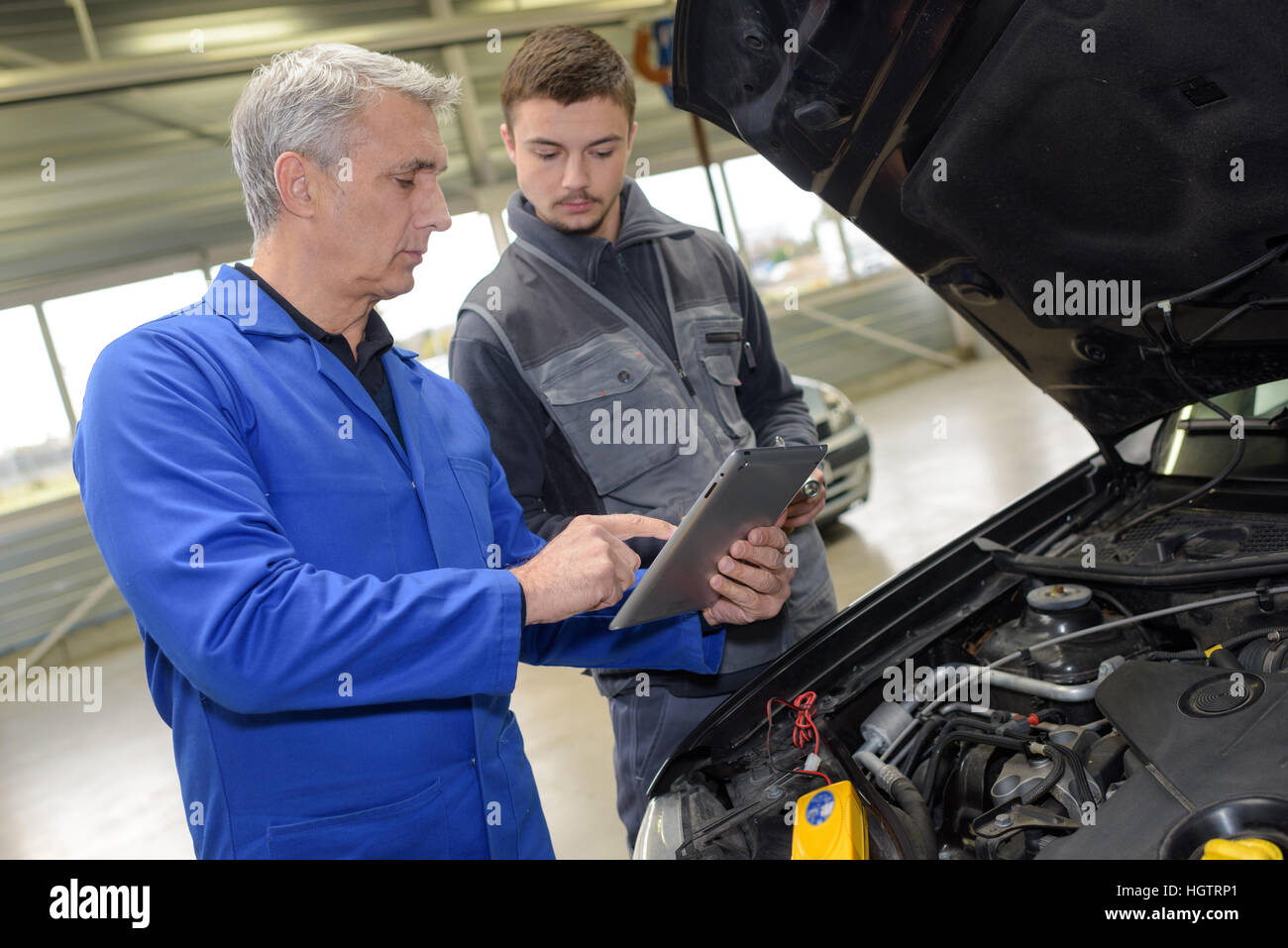 trainee mechanic at work Stock Photo - Alamy