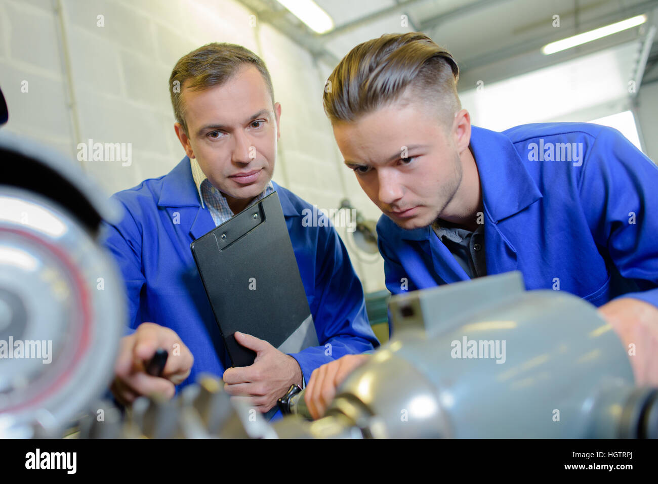 men on the workshop Stock Photo - Alamy