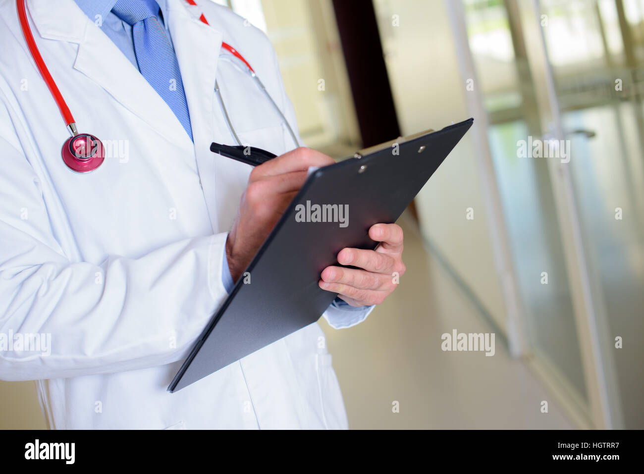 Male doctor writing notes clinical hi-res stock photography and images ...