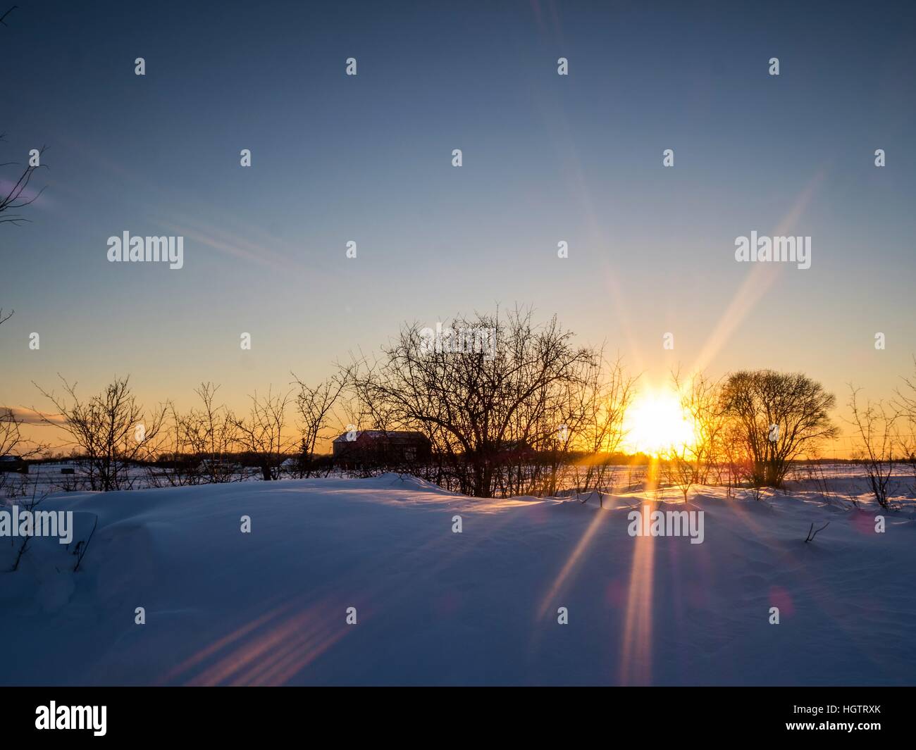 Sunset Over Snow In Winter Trees Orange Glow snow cold Stock Photo - Alamy
