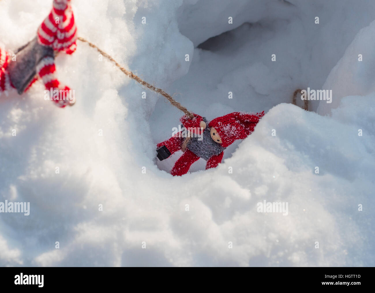 Small wooden toys in the rescue scene and assist, doll pulls a rope ...