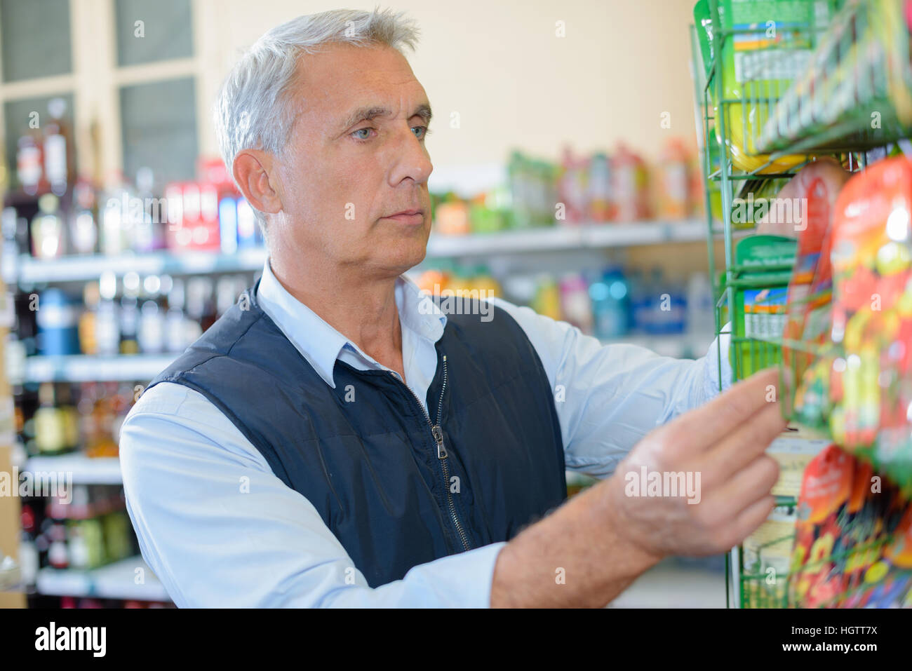 man choosing item in shop Stock Photo - Alamy man choosing item in shop Stock Photo - Alamy
