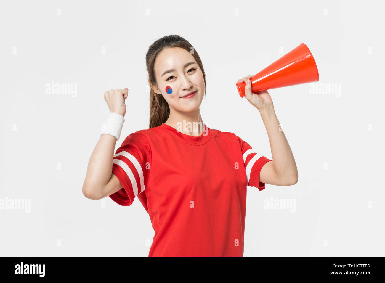 Portrait of young smiling Korean cheerleader woman with megaphone Stock ...