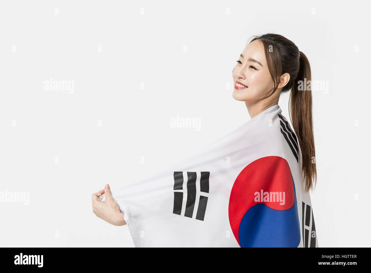 Side view young smiling Korean cheerleader woman Stock Photo - Alamy