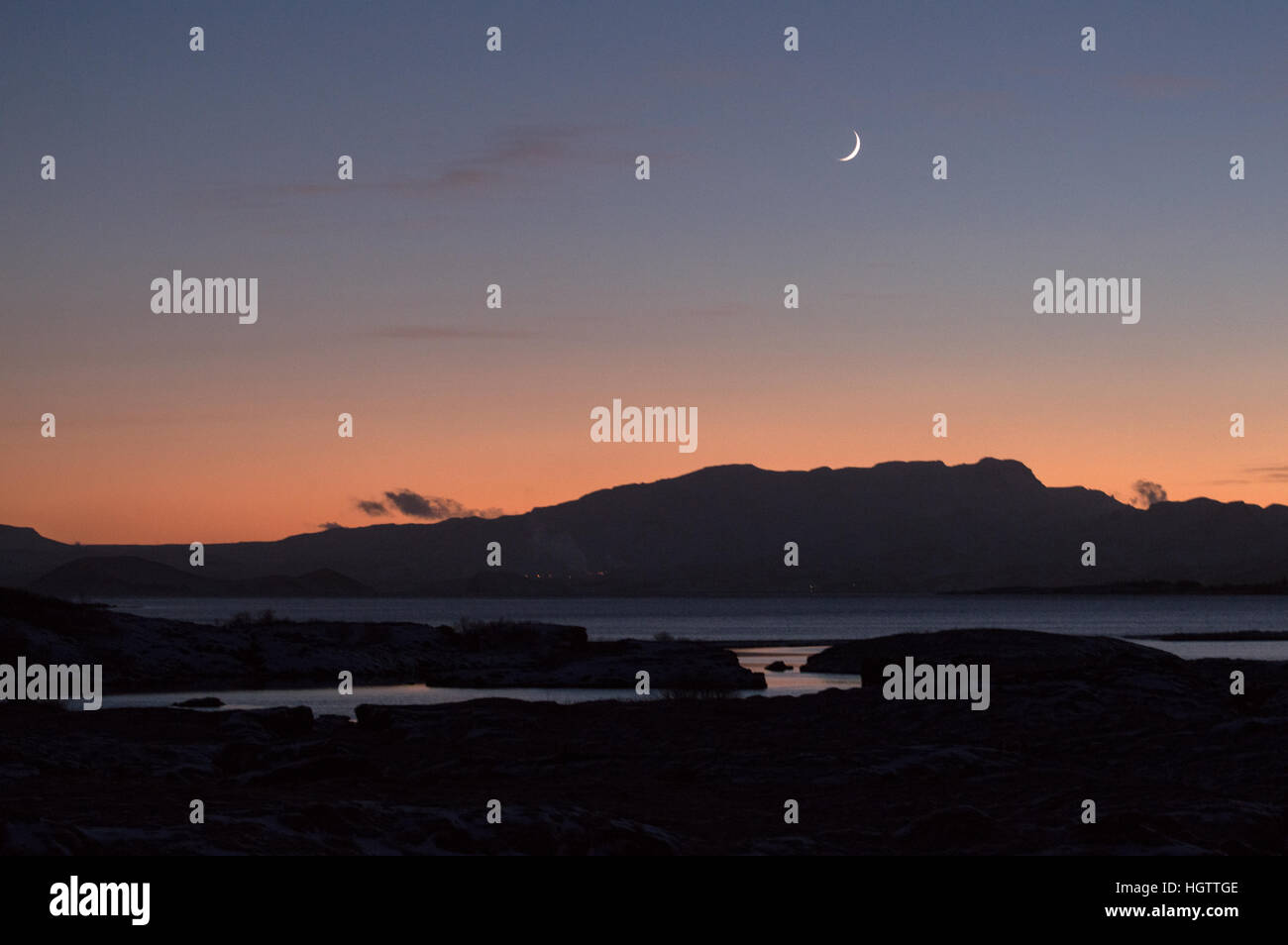 New moon in a clear winter sky over Thingvellir National Park in ...