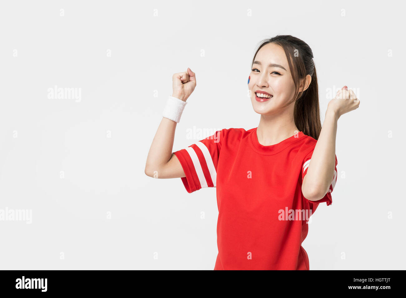 Young smiling Korean cheerleader woman Stock Photo - Alamy