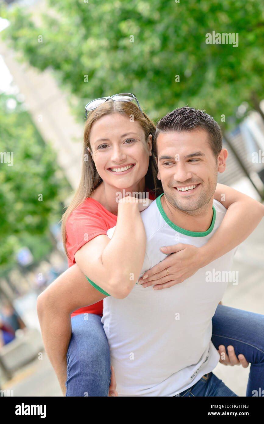 Piggy back couple Stock Photo - Alamy