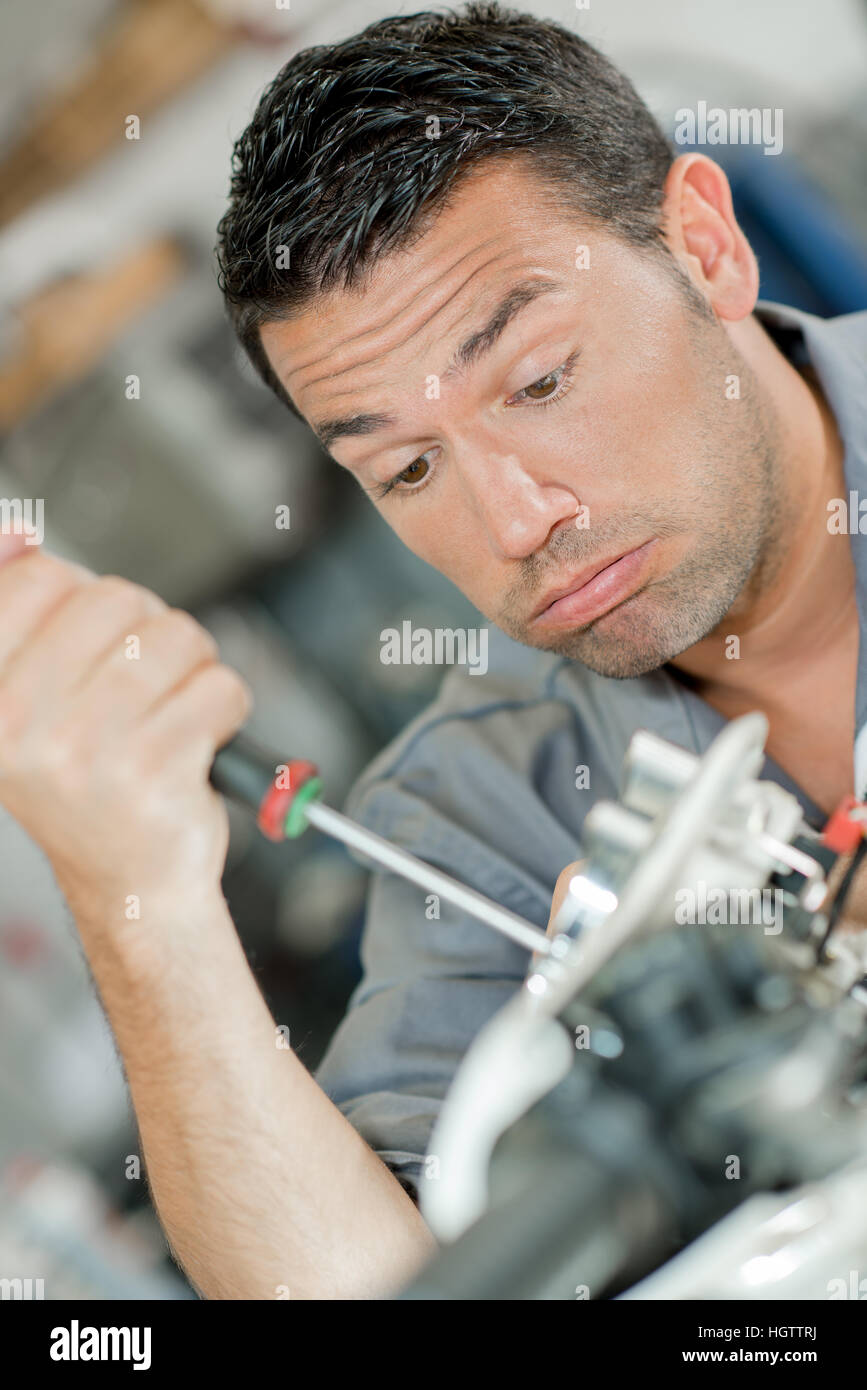 Bored looking mechanic hi-res stock photography and images - Alamy