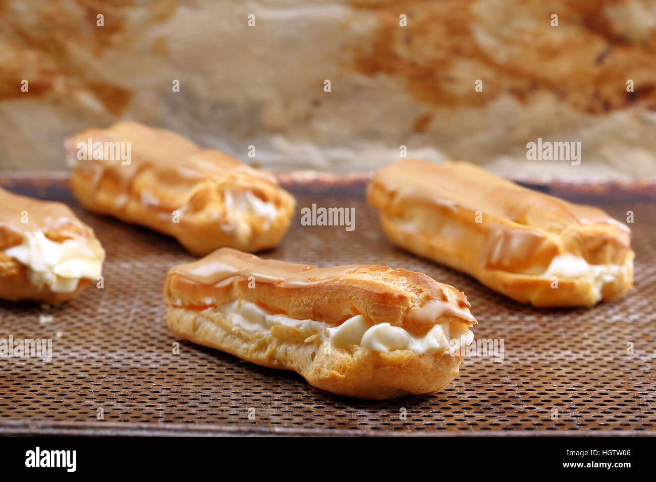 Sweet eclairs with cream. Catering set Stock Photo - Alamy