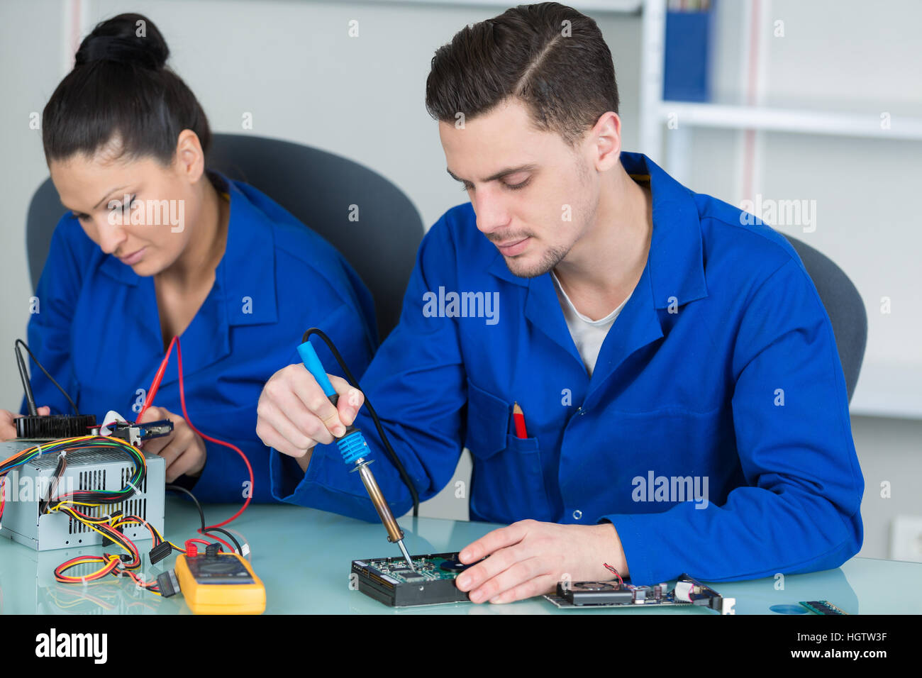 students in computing class fixing hardware Stock Photo - Alamy