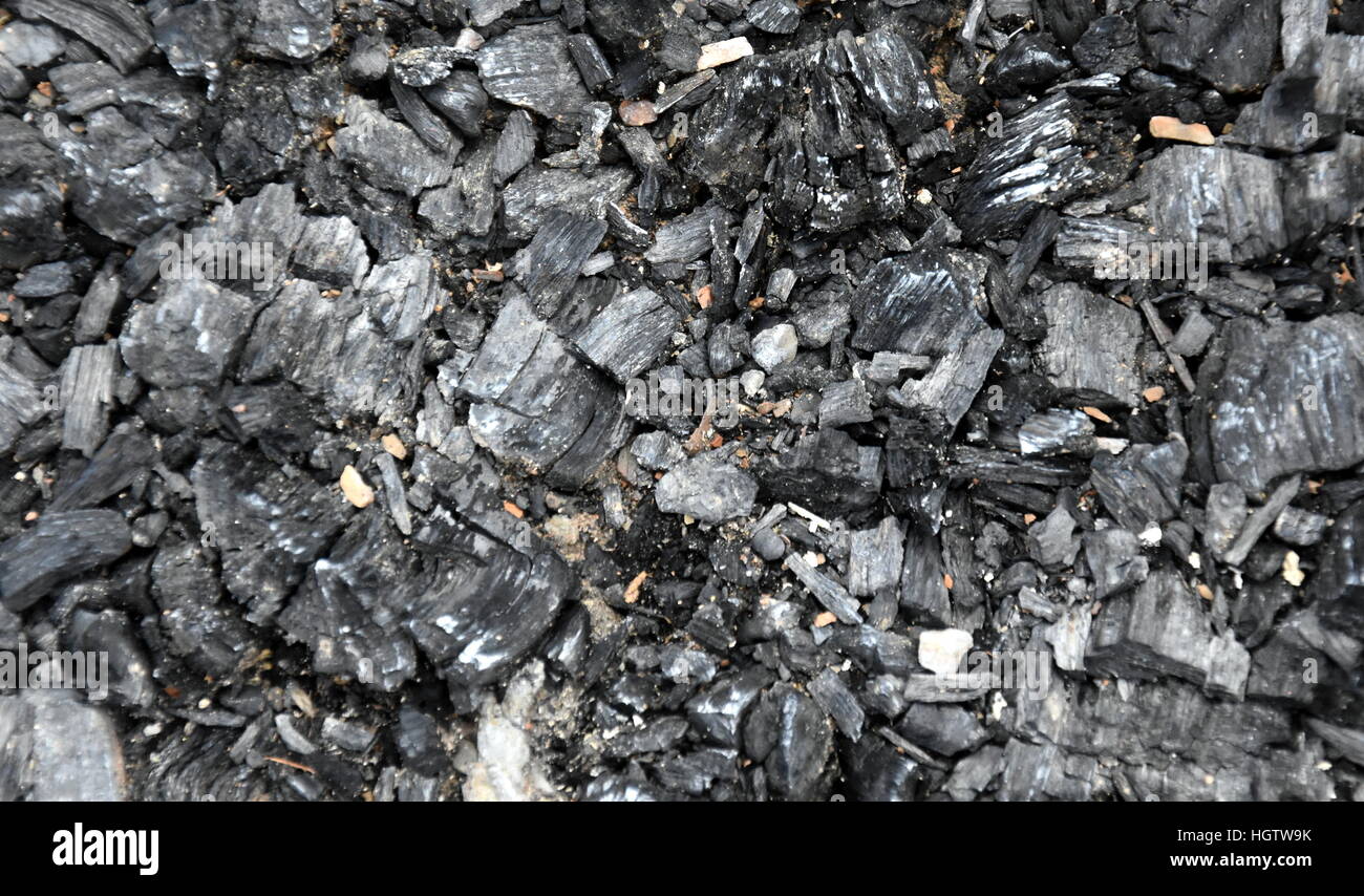 Extinct coals after bonfire. Ashes and cinders from waste burning ...