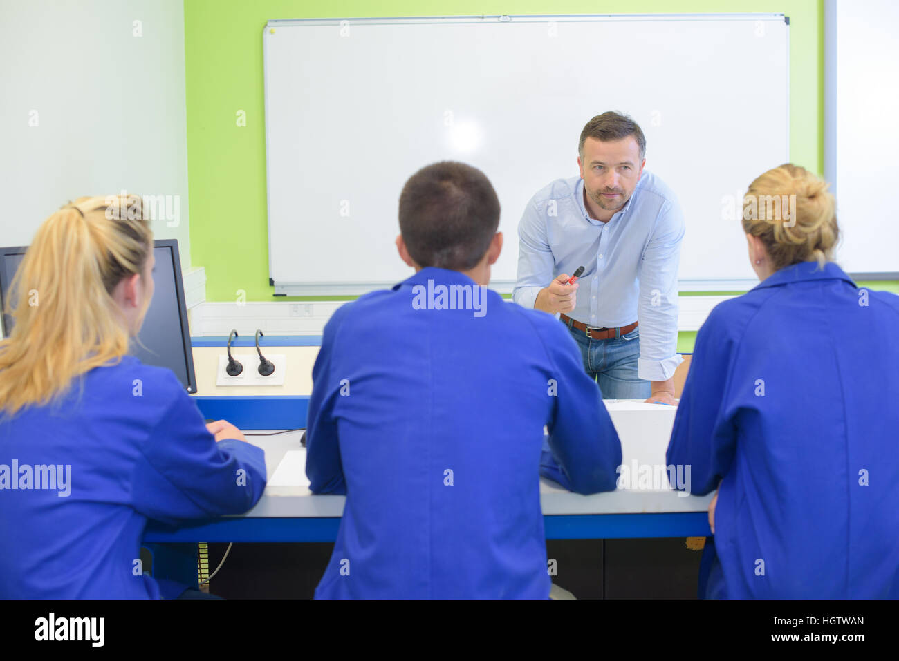 Leaning forward female student hi-res stock photography and images - Alamy