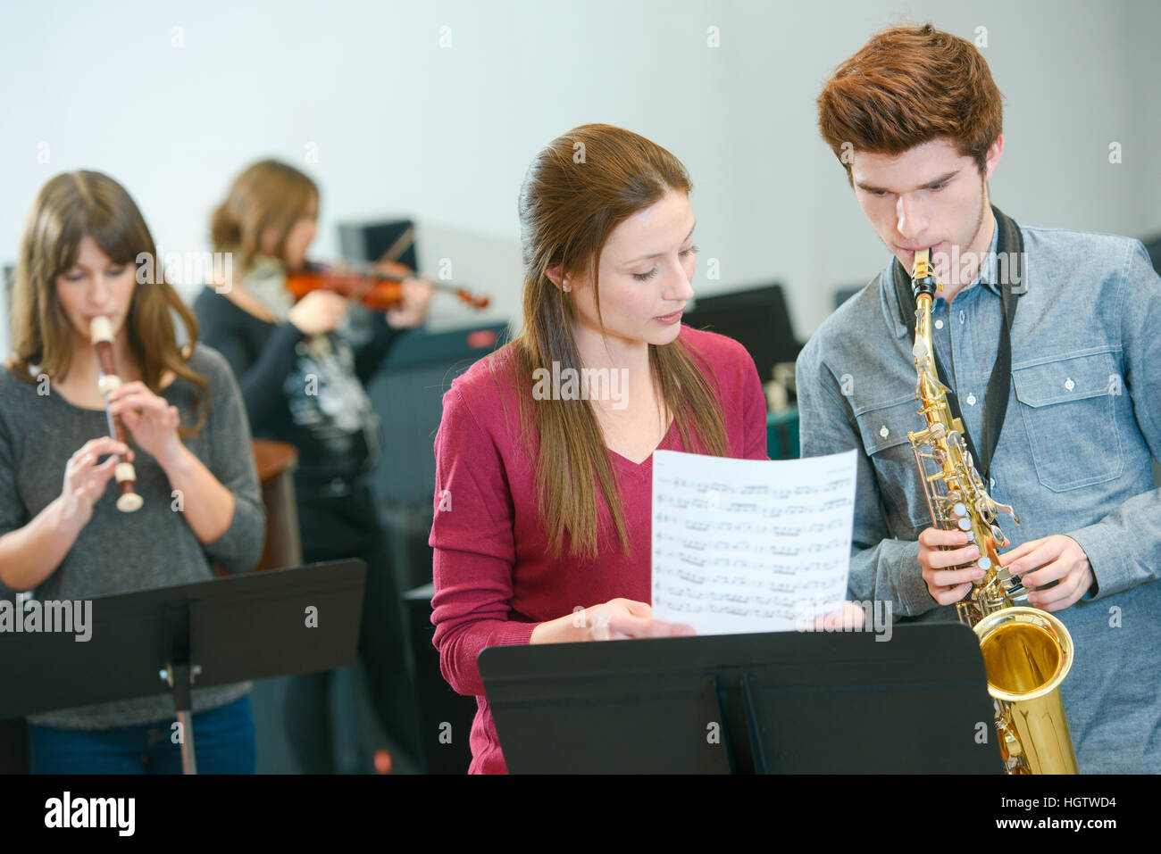Learning to play the sax Stock Photo - Alamy