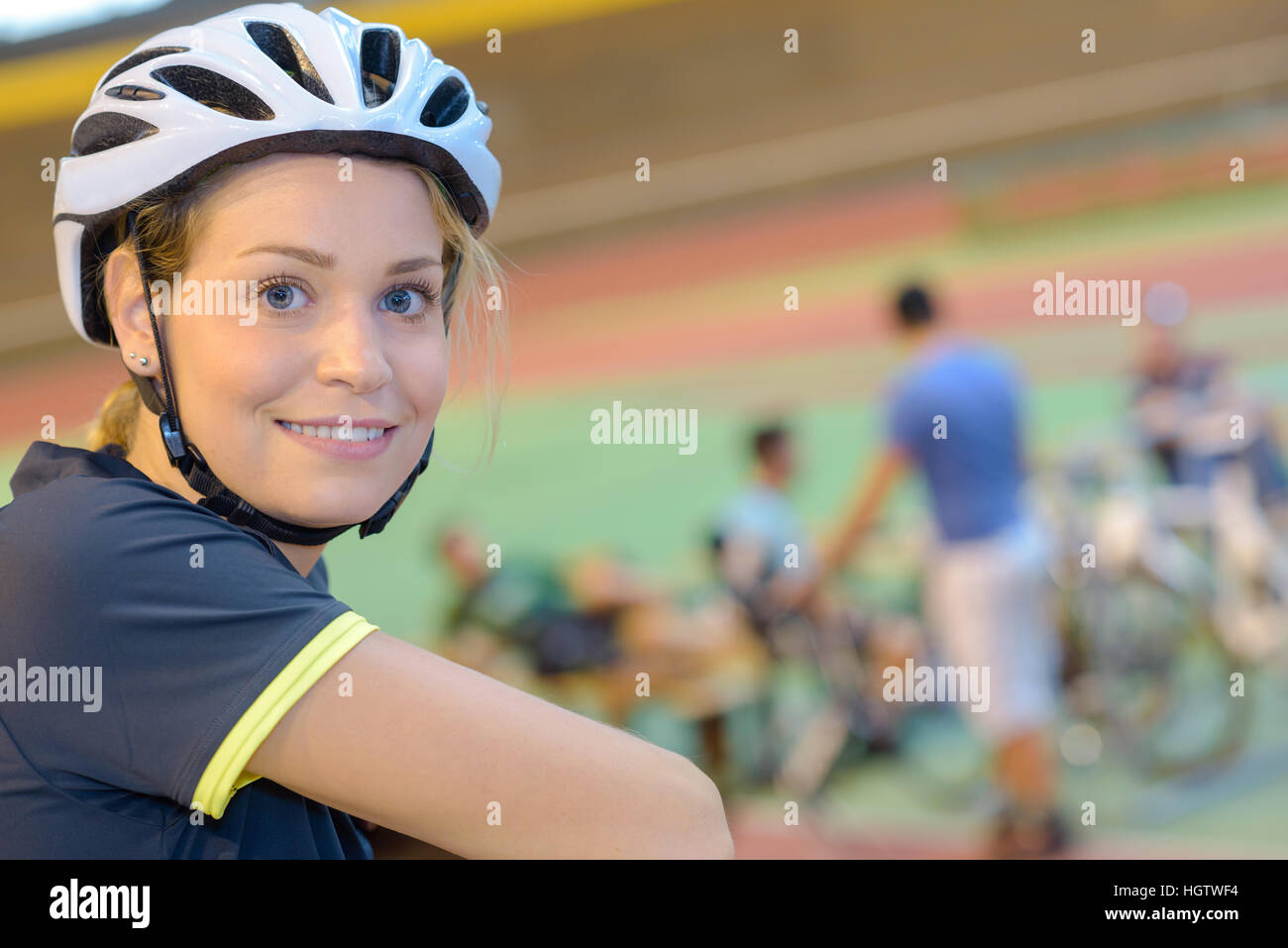 Portrait of young female cyclist Stock Photo - Alamy