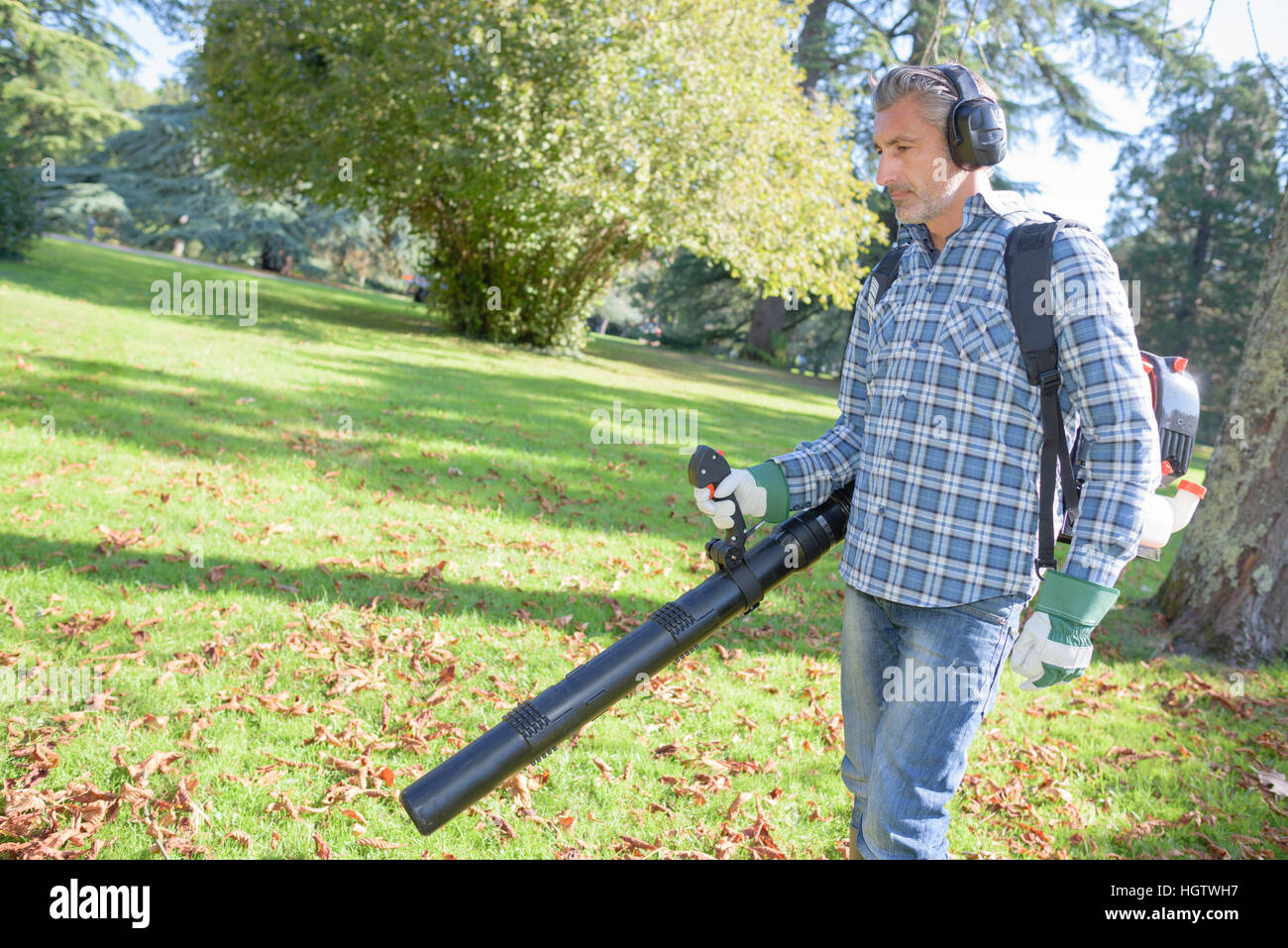 Man using leaf blower Stock Photo - Alamy