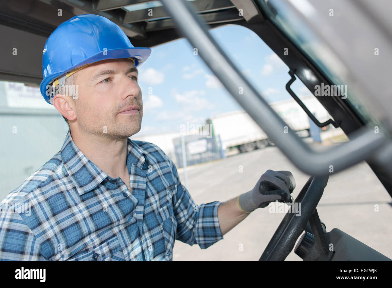 Closeup of forklift driver Stock Photo - Alamy