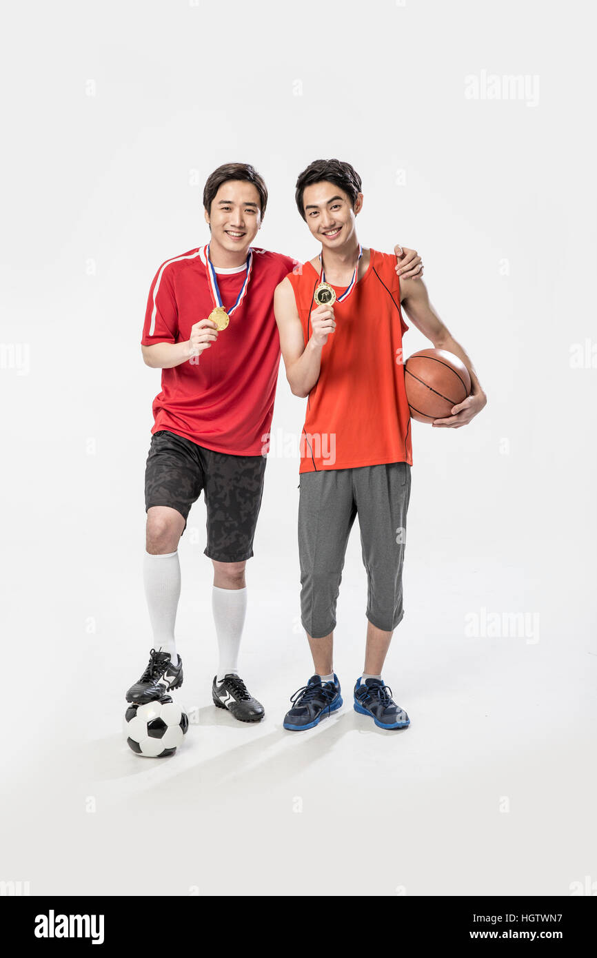 Two young smiling Korean sports players posing Stock Photo - Alamy