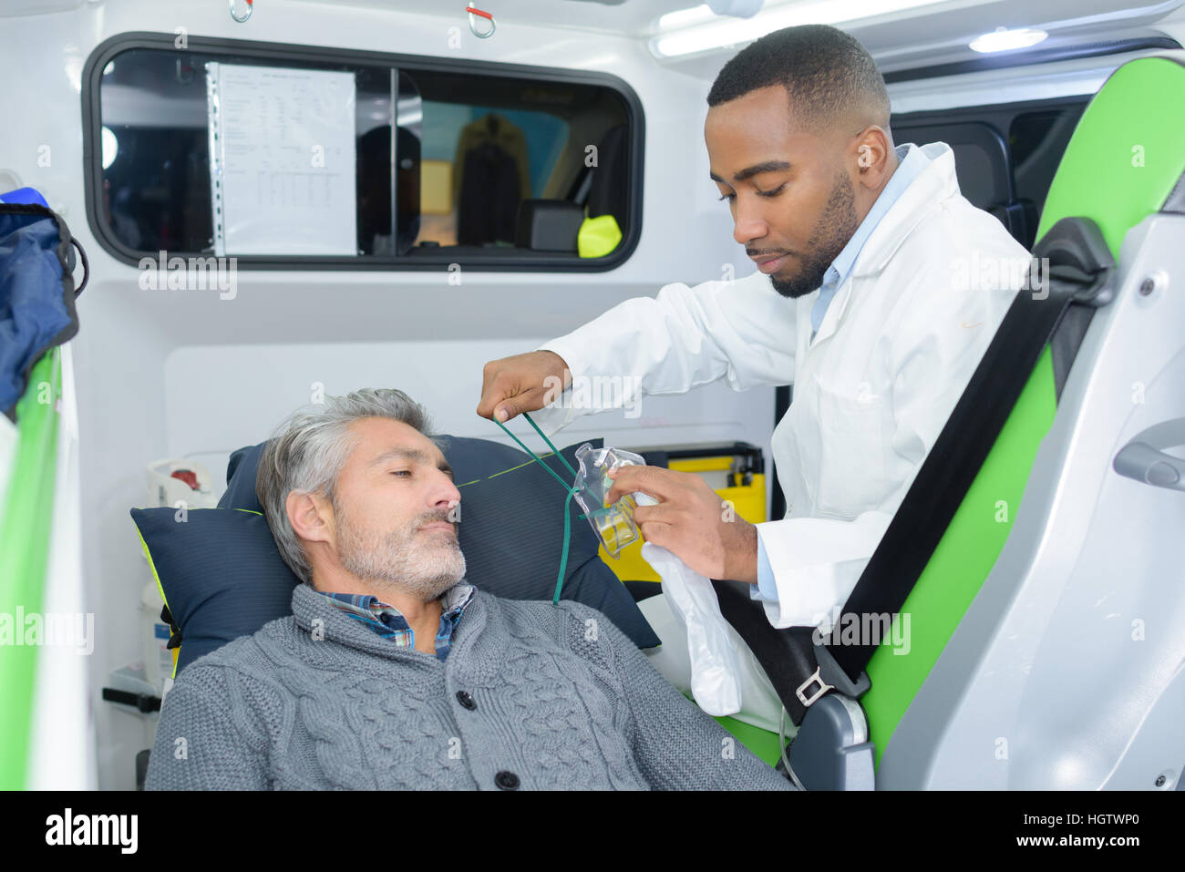 putting breathing mask Stock Photo - Alamy