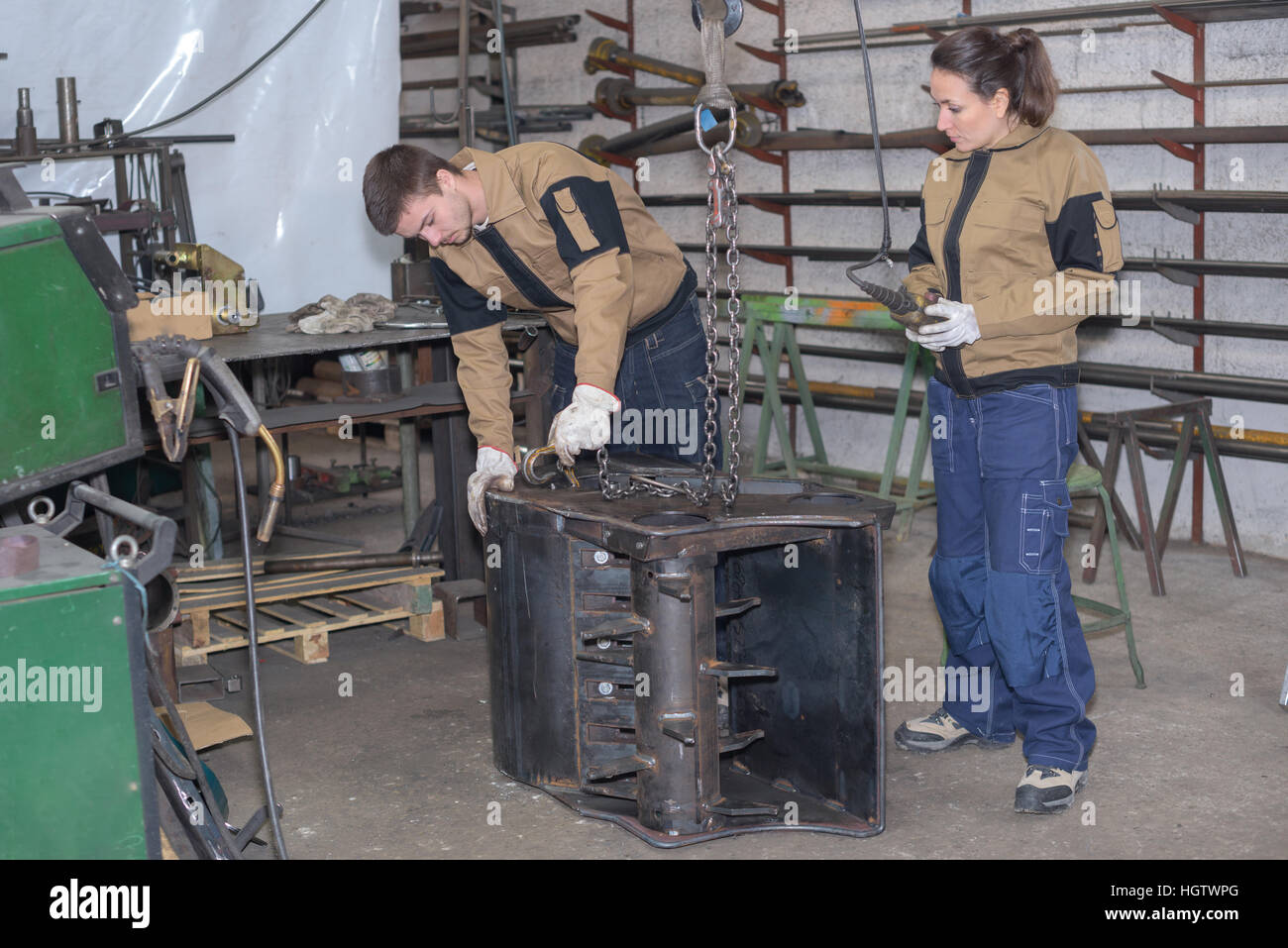 employees using industrial machinery at factory Stock Photo - Alamy