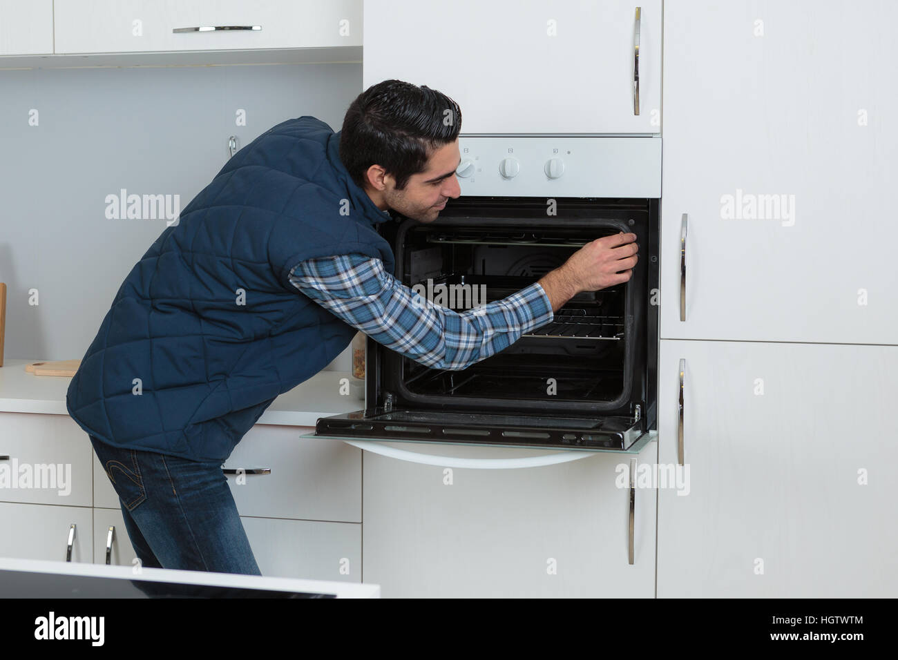 checking the oven Stock Photo - Alamy