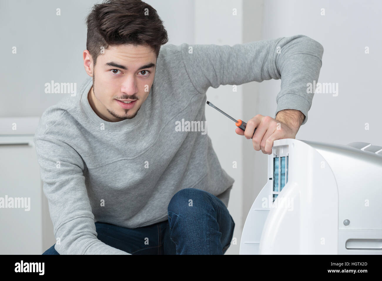man holding a screwdriver Stock Photo - Alamy