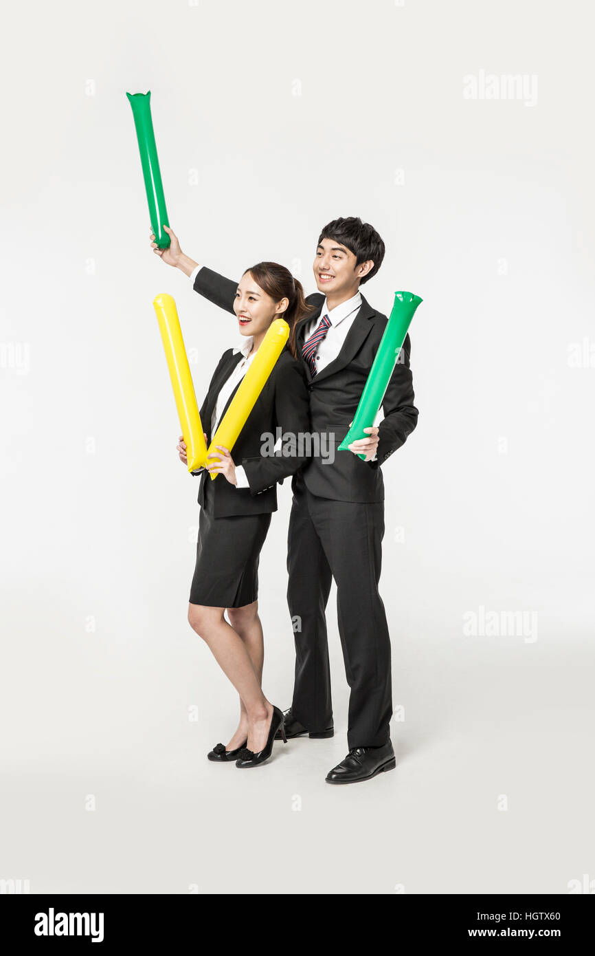 Young smiling business people cheering Stock Photo - Alamy