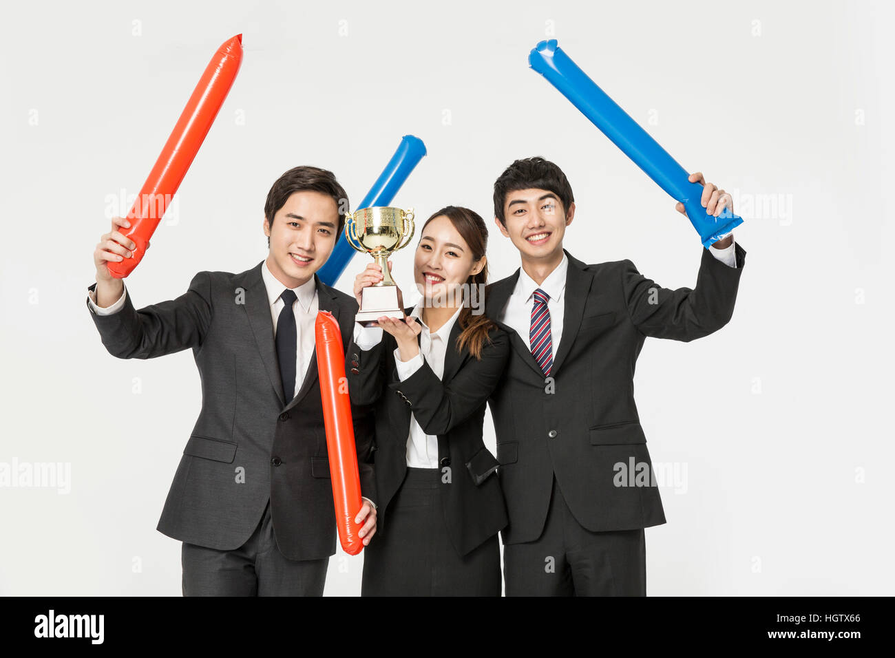 Young smiling business people cheering Stock Photo - Alamy