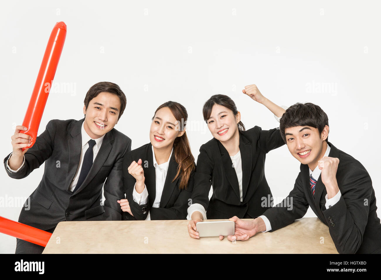 Portrait of young smiling business people cheering Stock Photo - Alamy