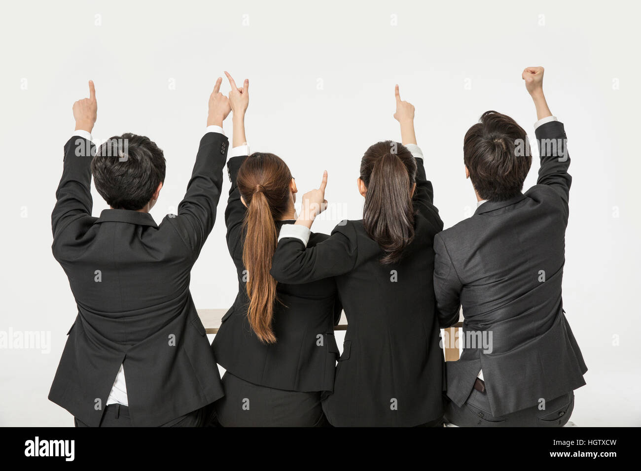 Back young people cheering sitting hi-res stock photography and images ...
