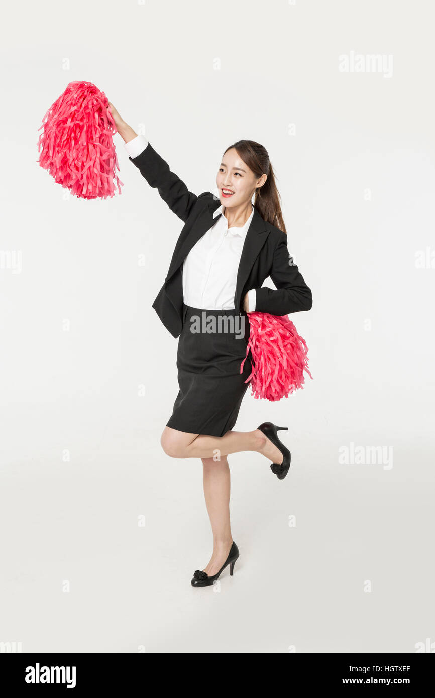 Young smiling businesswoman cheering Stock Photo - Alamy