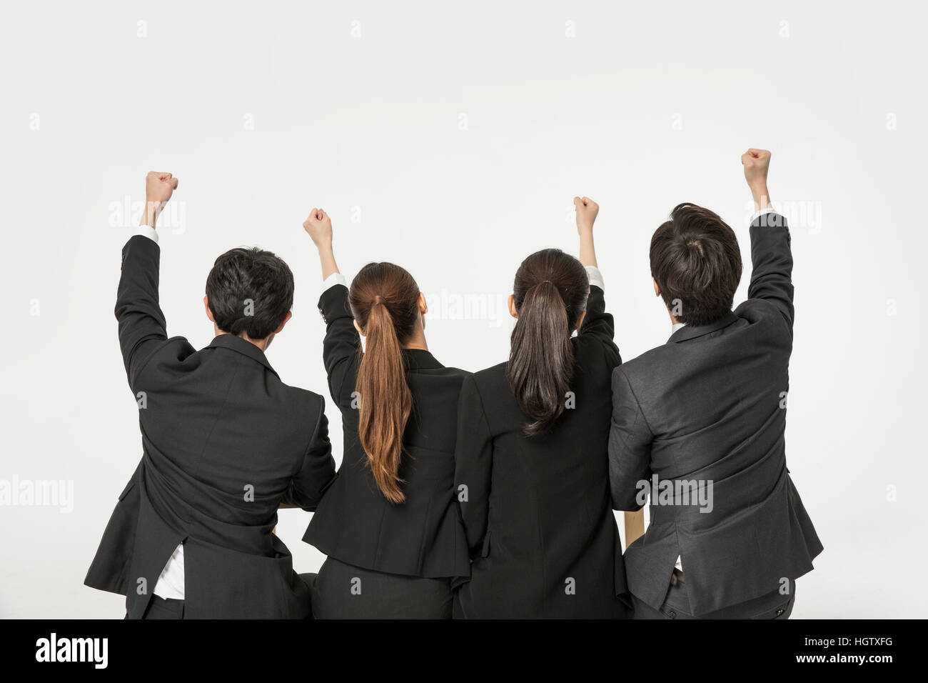 Back young people cheering sitting hi-res stock photography and images ...