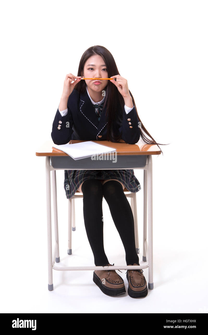 Korean high school girl sitting at desk Stock Photo - Alamy