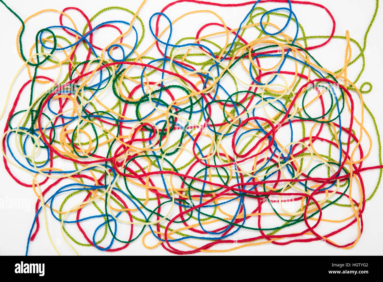 Background with tangled colorful threads Stock Photo - Alamy