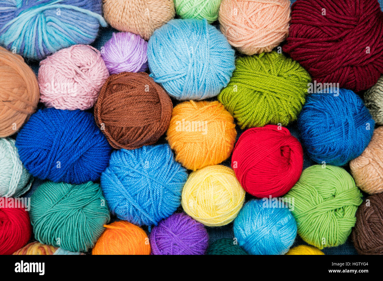 Background with lots of colorful yarns Stock Photo - Alamy
