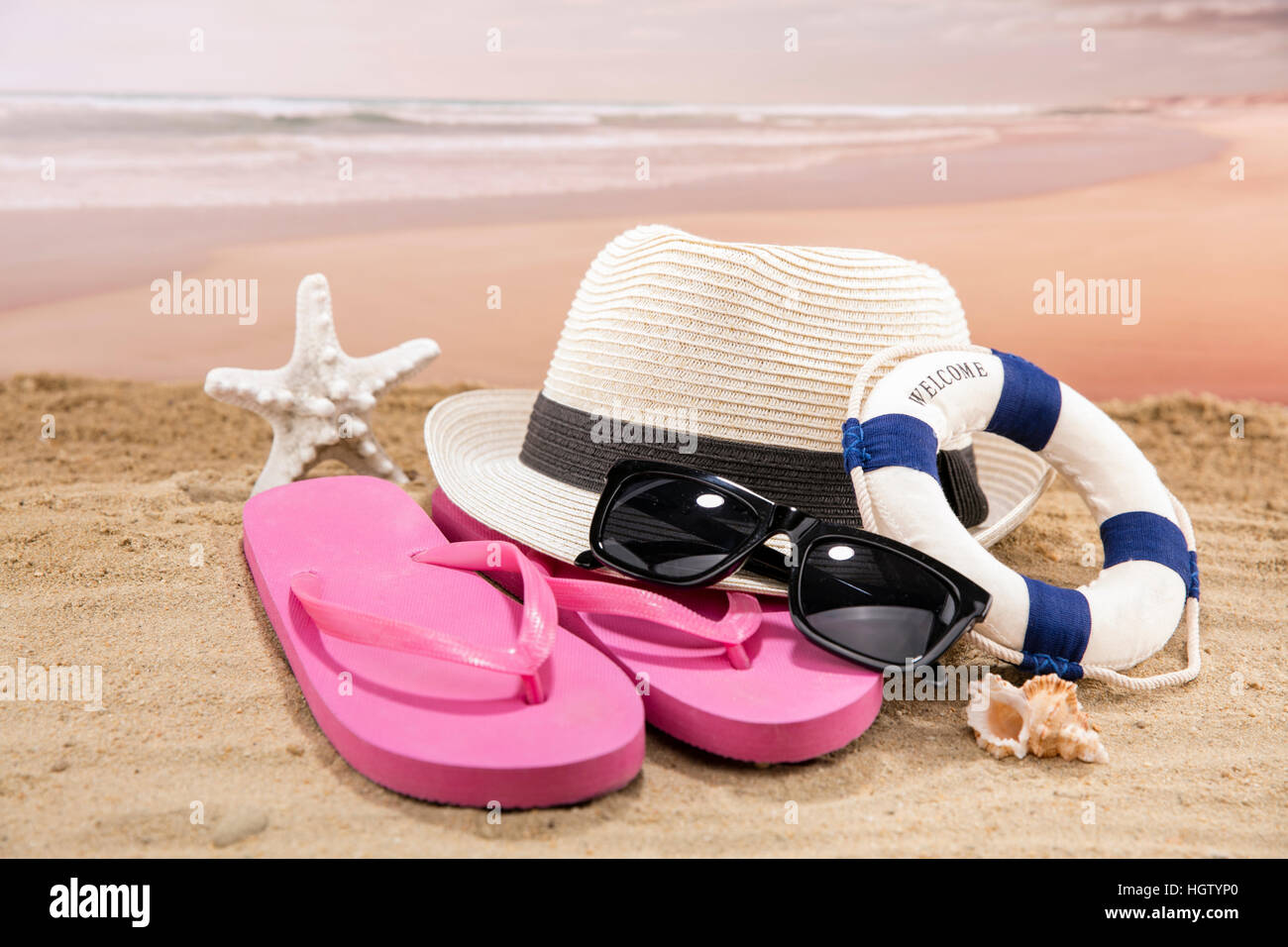 Objects for summer vacation on beach Stock Photo - Alamy
