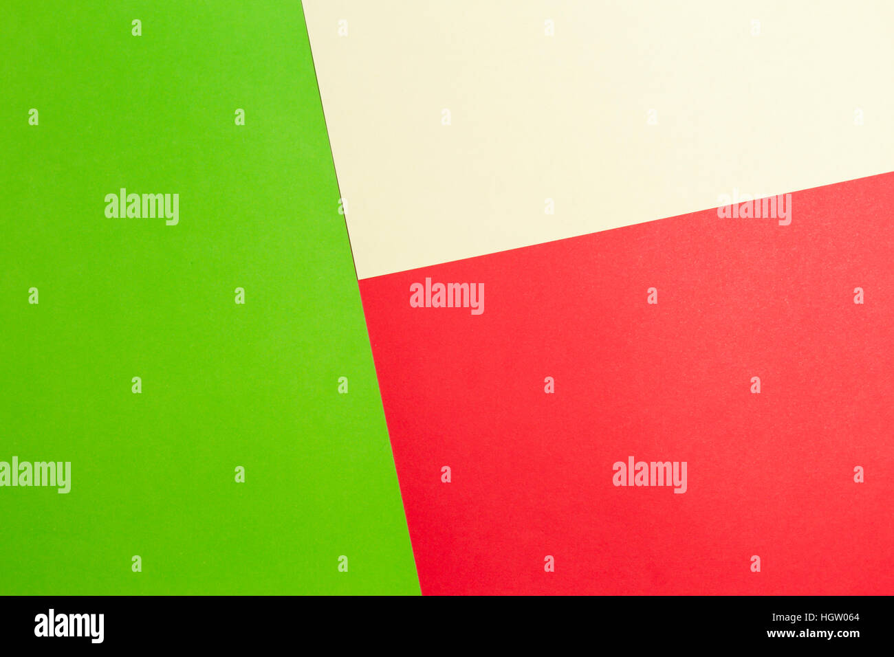 Greenery, red and yellow colored paper background Stock Photo - Alamy