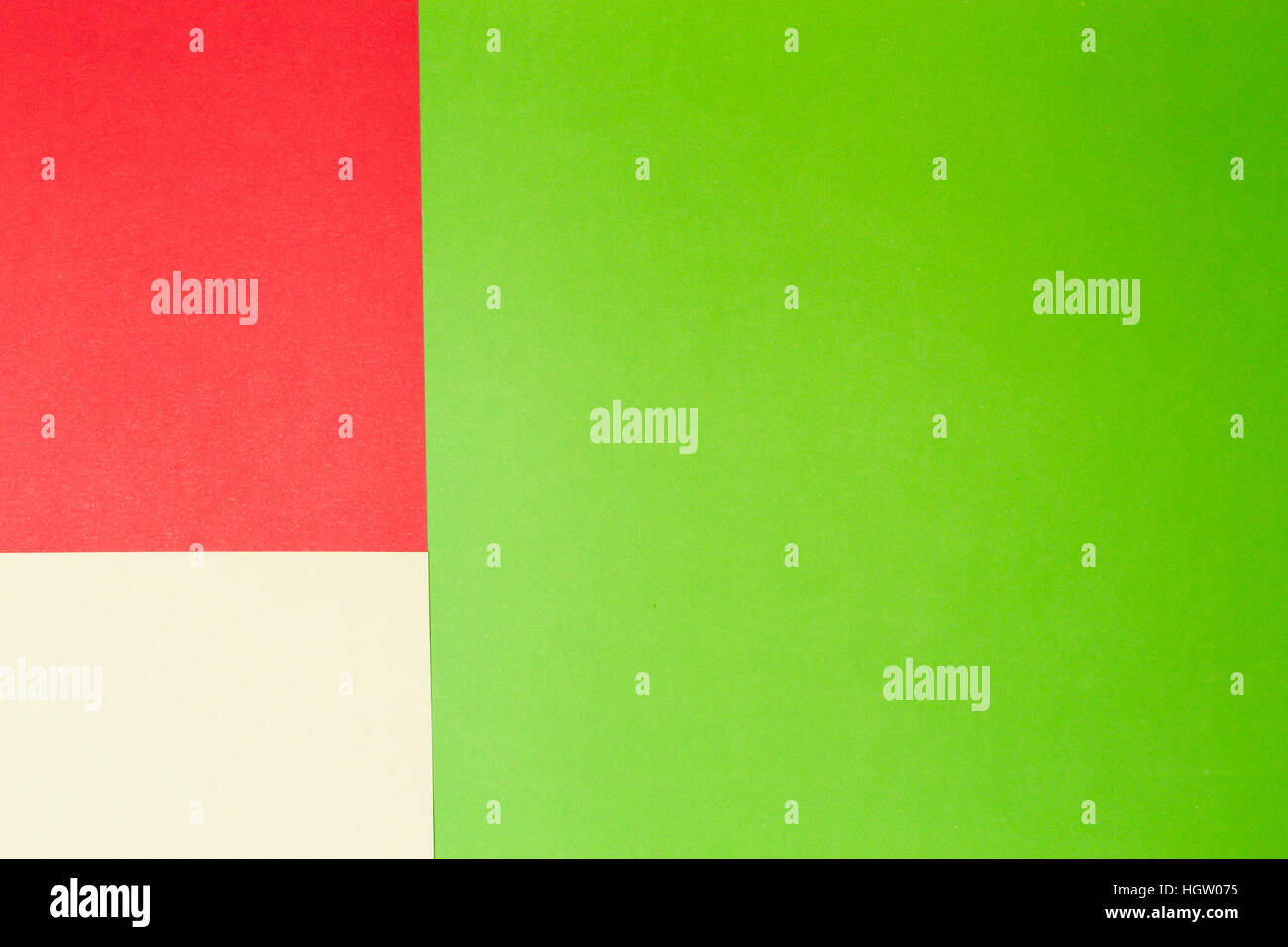 Greenery, red and yellow colored paper background Stock Photo - Alamy