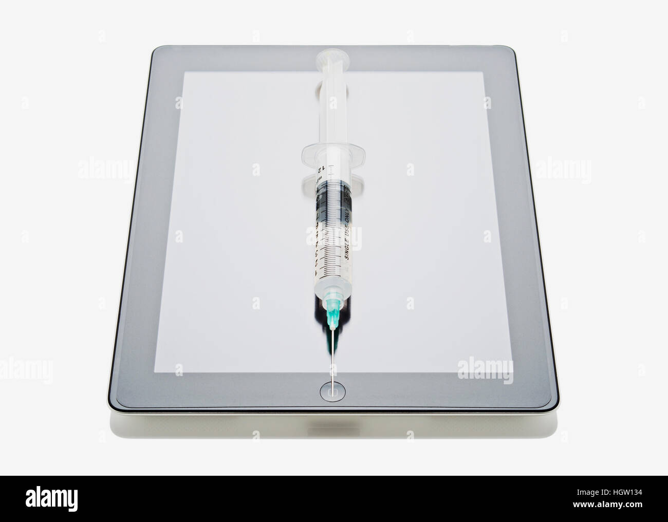 Digital Tablet And Syringe Stock Photo - Alamy