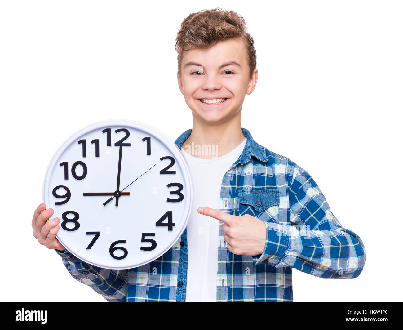 Teen boy with big clock Stock Photo - Alamy