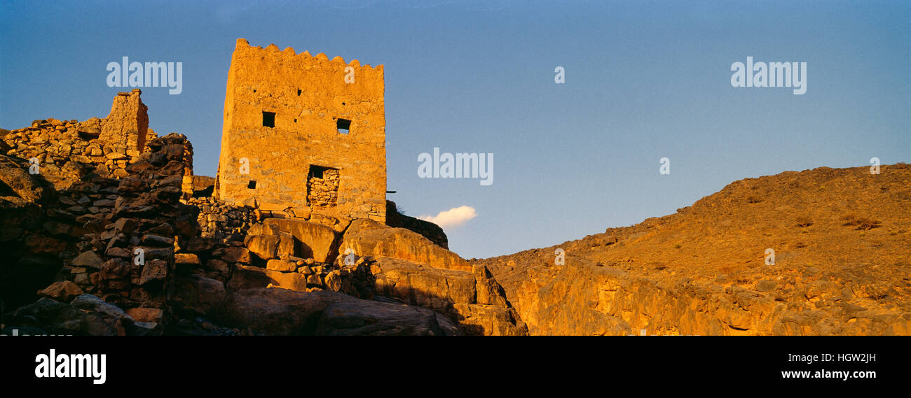 An ancient handmade stone watchtower in an abandoned mountain desert ...