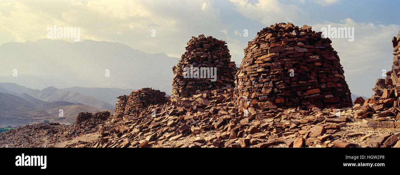Ancient handmade stone burial mounds and tombs atop a desert ridge ...