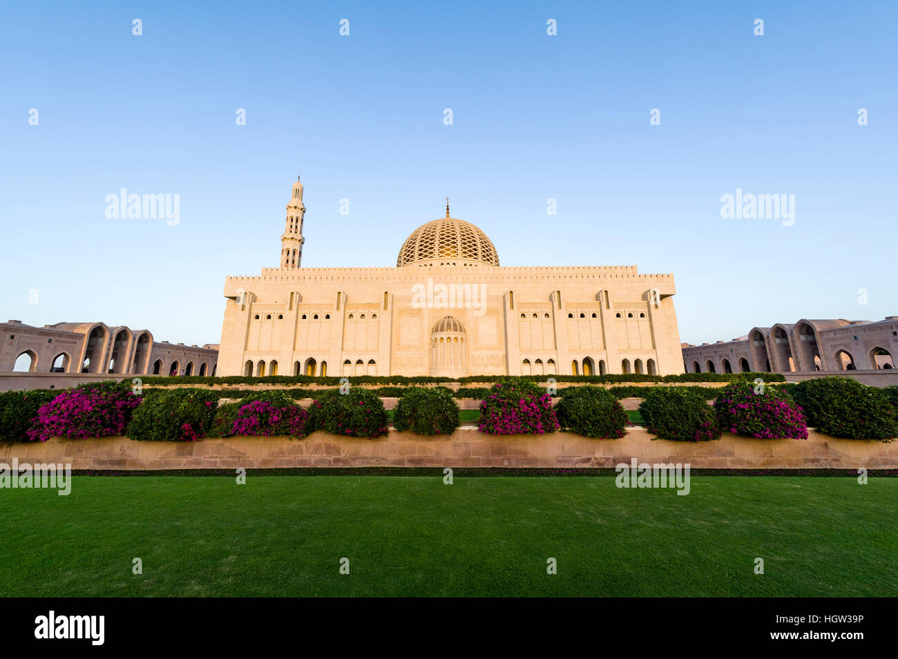Manicured lawns and flower gardens surround the Grand Mosque Stock ...